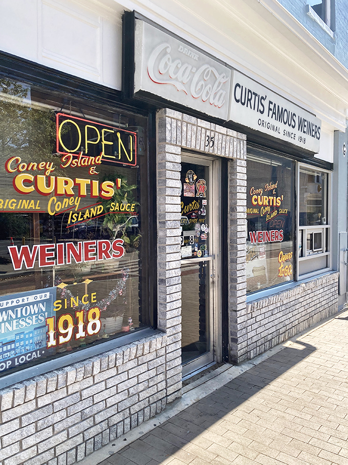 The classic Coca-Cola signage and retro window art at Curtis' Famous Weiners transports you to an era when "wiener" was the sophisticated term.