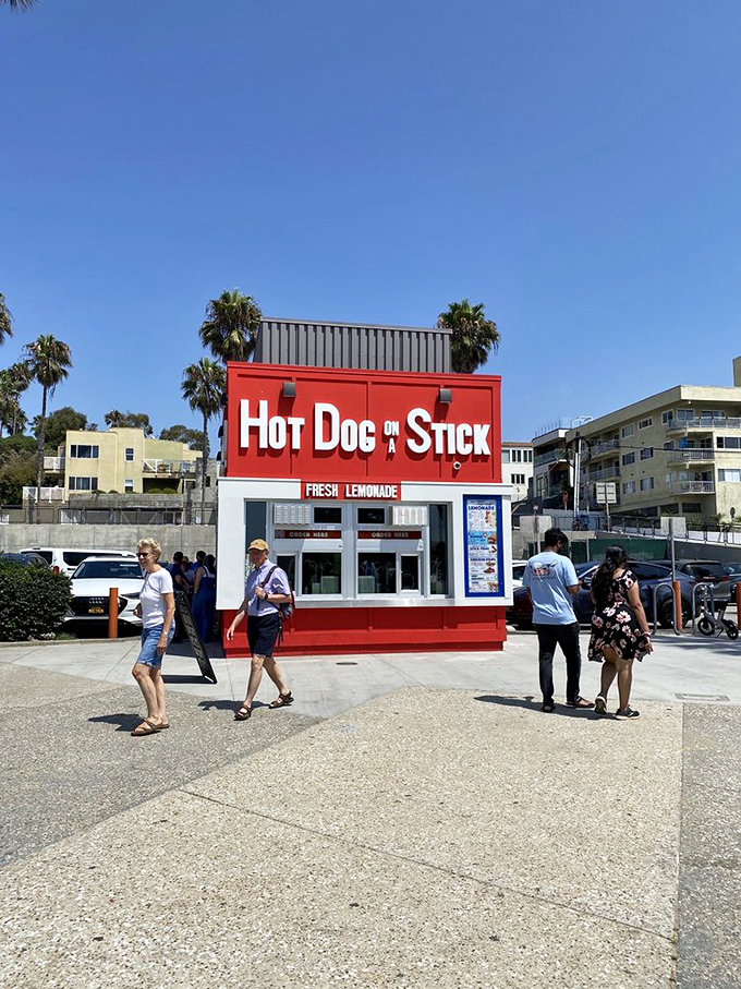 The simple, vibrant stand draws a steady stream of beachgoers seeking that perfect combination of fried goodness and ocean views.