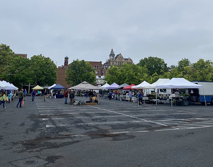 White tents against historic architecture &ndash; a picture-perfect setting for finding everything from heirloom tomatoes to heirloom furniture.