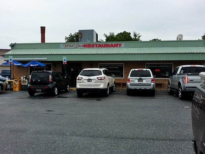 Green awnings and brick walls frame the entrance to Milford's living culinary history book, written daily in gravy and griddle marks.