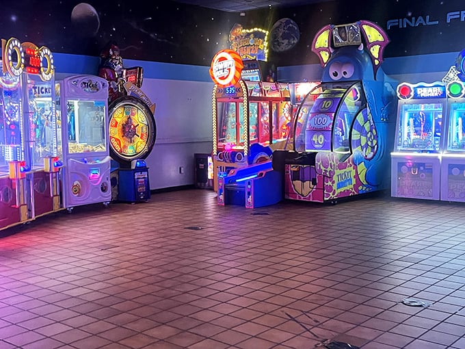 The arcade glows with neon promises, where quarters disappear faster than your bowling confidence after three straight gutter balls.