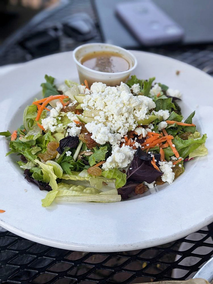 A salad that doesn't apologize for being a salad&mdash;fresh greens, vibrant carrots, and crumbled cheese create a garden party worth attending.