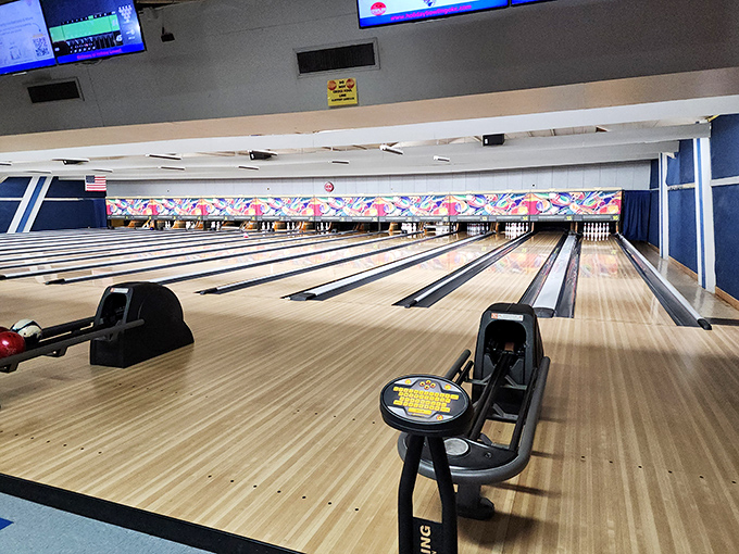 Each ball return station waits patiently for its next bowler, a constant reminder that sometimes the best technology doesn't need updating every six months.