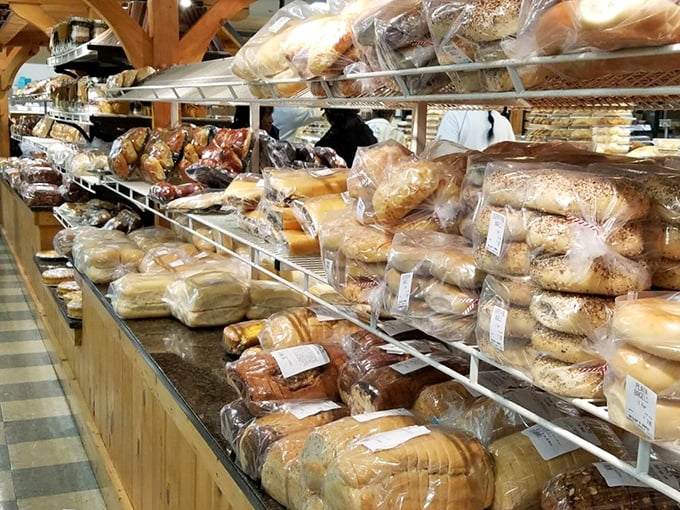 Bread paradise where loaves line up like soldiers, each one ready to transform your ordinary sandwich into the highlight of your week.