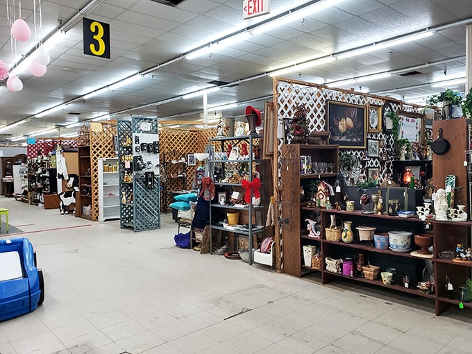 The wooden lattice dividers create mini-universes of collectibles. Each booth is its own carefully curated galaxy of treasures, orbiting around a vendor's passion.