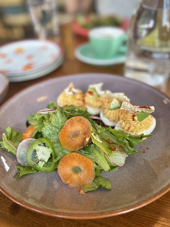 These aren't your aunt's potluck deviled eggs. Delicately plated with fresh vegetables and microgreens, they've graduated from church basement to culinary spotlight.