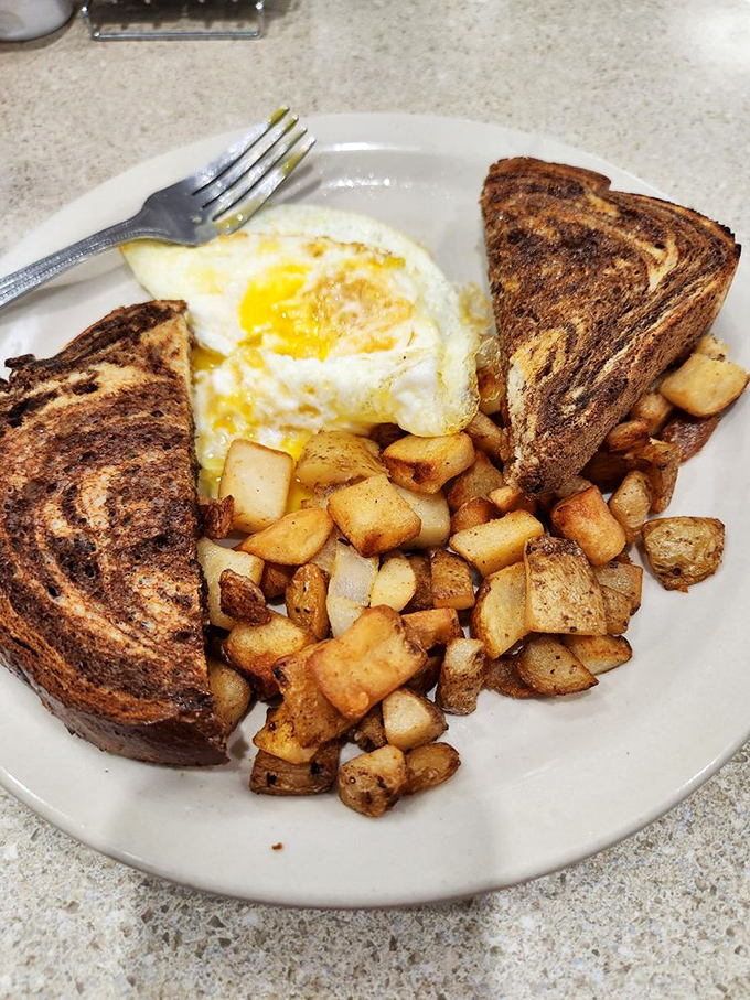 Simple perfection on a plate&mdash;perfectly toasted rye, sunny-side up eggs, and potatoes that have achieved the golden-brown standard every spud aspires to.