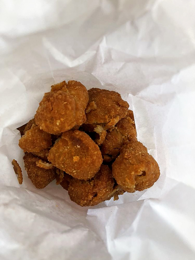 Golden-fried mushroom bites waiting to be dunked in cool dip. Like popcorn's sophisticated cousin who studied abroad and came back with stories.