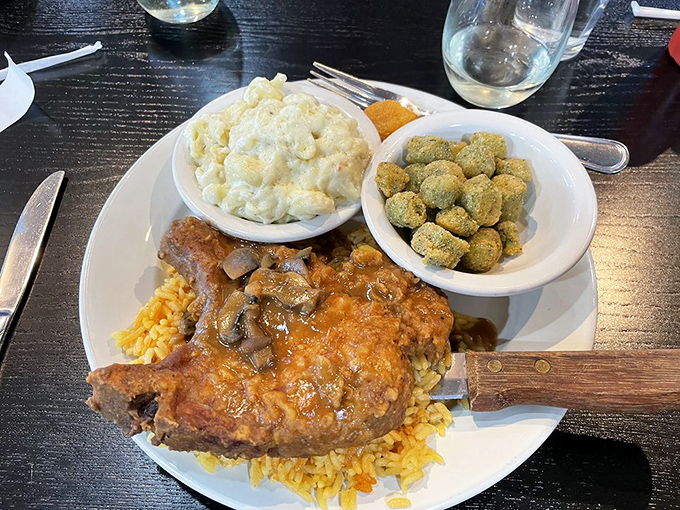 What looks like smothered pork chop resting on a bed of rice with green beans and carrot souffl&eacute;. Comfort food that hugs you from the inside out.