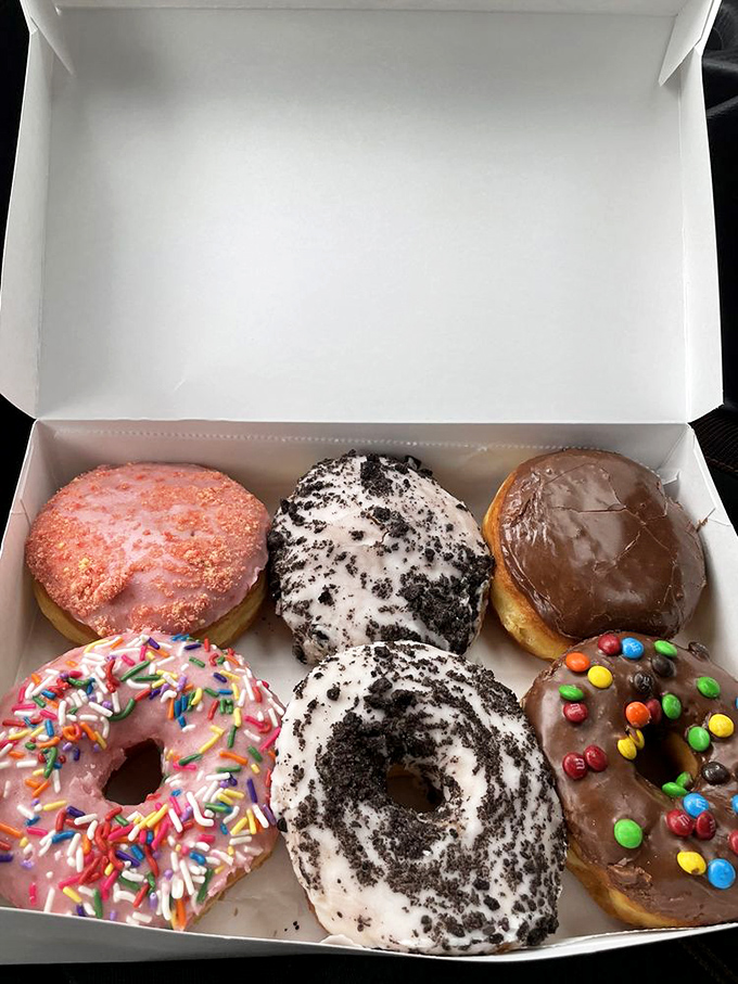 A half-dozen donuts arranged like edible artwork&mdash;proof that "I'll just get one" is the biggest lie we tell ourselves.