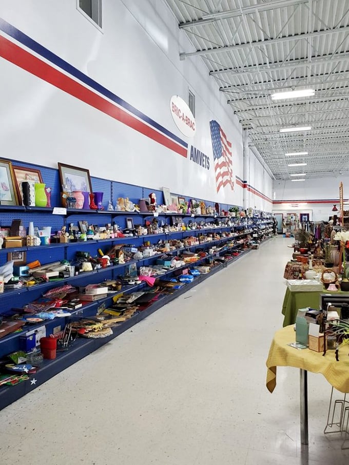 Blue pegboard showcases everything from crystal that once graced formal tables to quirky novelty mugs perfect for your morning coffee ritual.