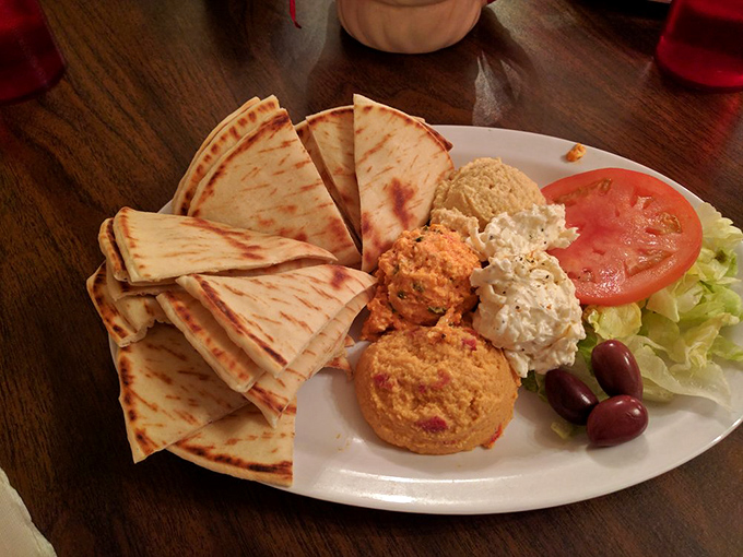 The hummus trio with warm pita triangles: proof that chickpeas can achieve greatness when properly motivated by garlic and olive oil.