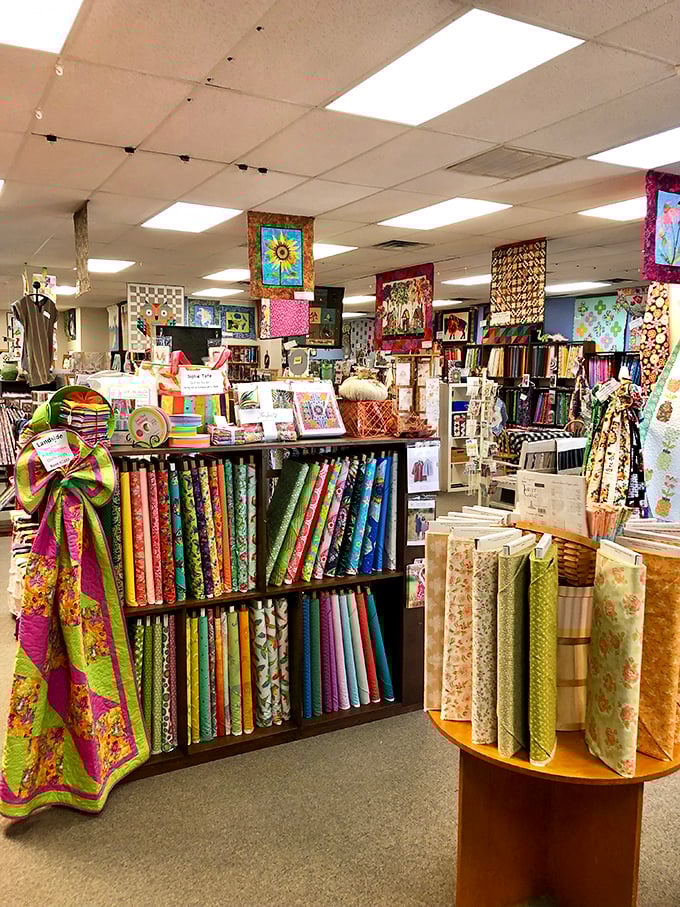 A textile library where each shelf tells a different color story. The organization here would make Marie Kondo weep with joy.