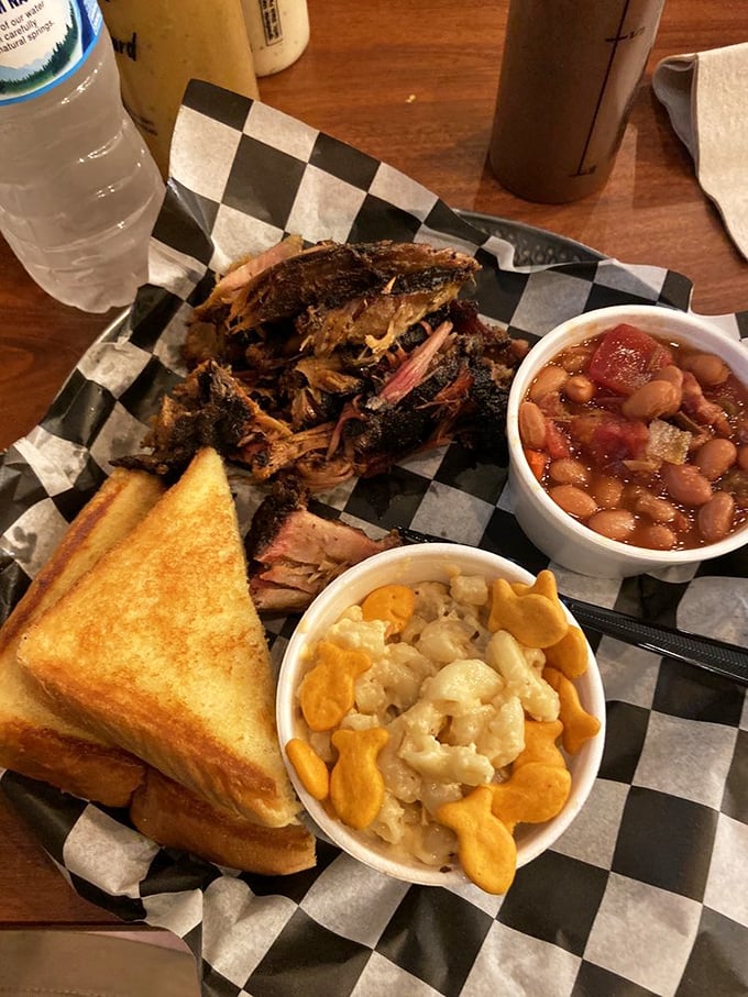 Brisket with that perfect bark, beans that clearly simmered alongside the meat, and mac and cheese that's practically glowing with cheesy promise.
