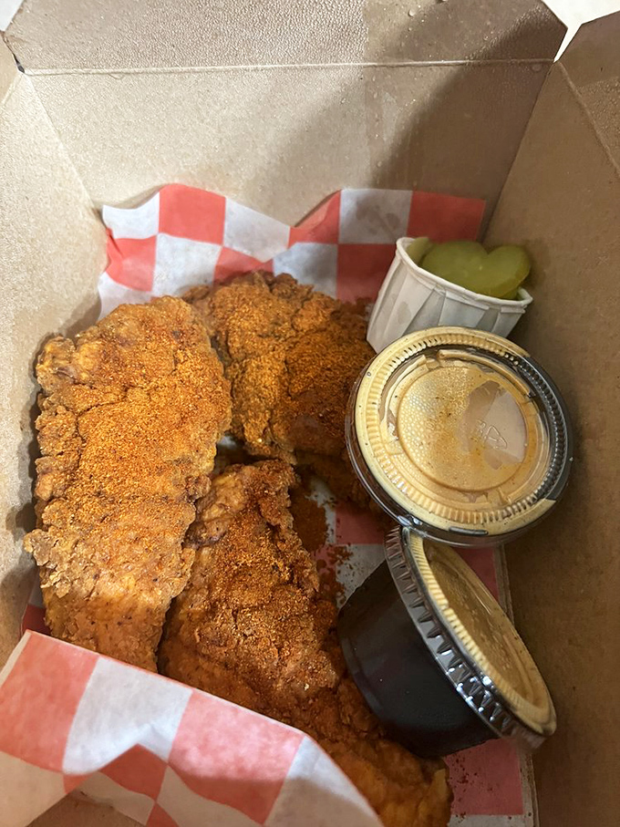 Two sauce cups mean you're doing it right. That deep golden-red coating whispers sweet nothings to your eyes before shouting at your taste buds.