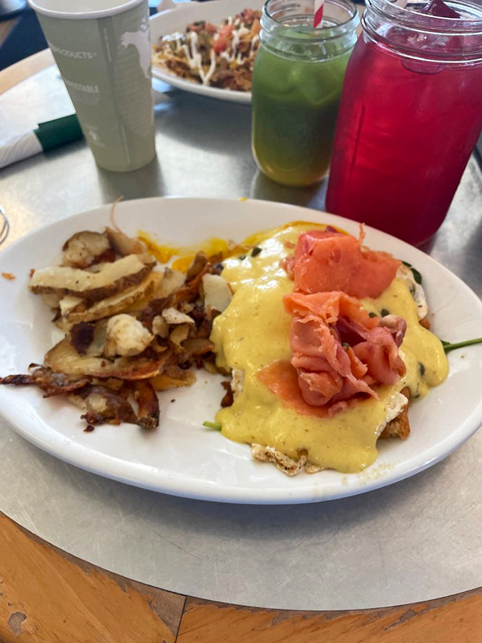 Benedict elevated: perfectly poached eggs draped in hollandaise, making spinach feel like it won the lottery of breakfast companions.