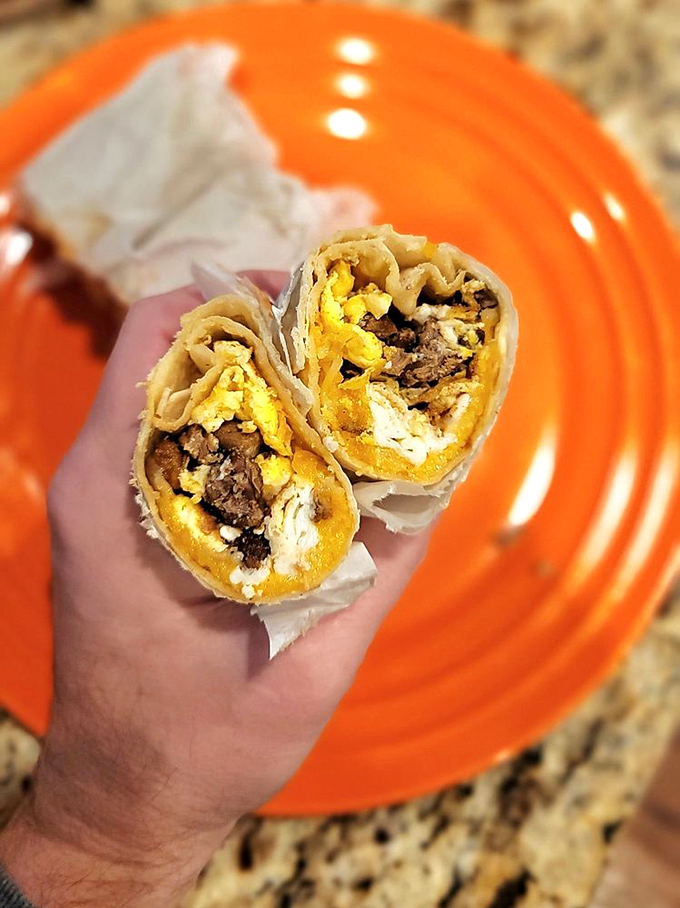 Cross-section perfection reveals the golden marriage of eggs and cheese embracing savory meat&mdash;a breakfast trilogy more compelling than any Hollywood franchise.