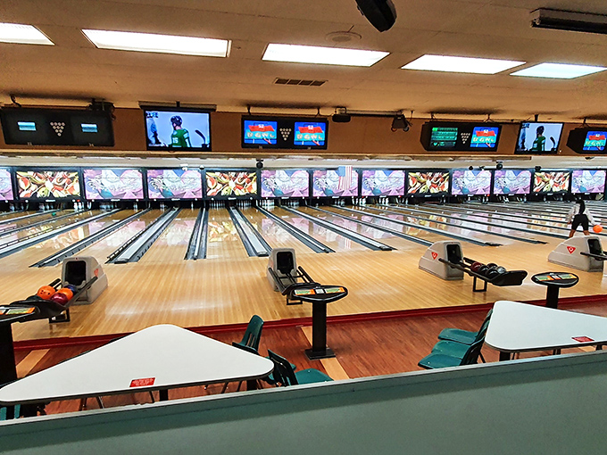 League night in full swing, where office hierarchies dissolve and true character is revealed through bowling form and french fry sharing.