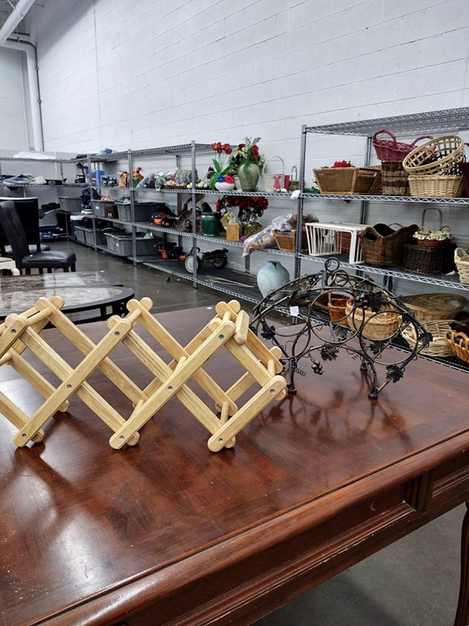 A pink scooter adds a pop of whimsy among the practical. In the thrift store universe, this is what passes for a unicorn.