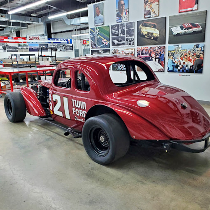 The #21 Twin Ford coupe looks surprisingly nimble for something built when "aerodynamics" meant "just make it go fast and pray." Pure engineering artistry.