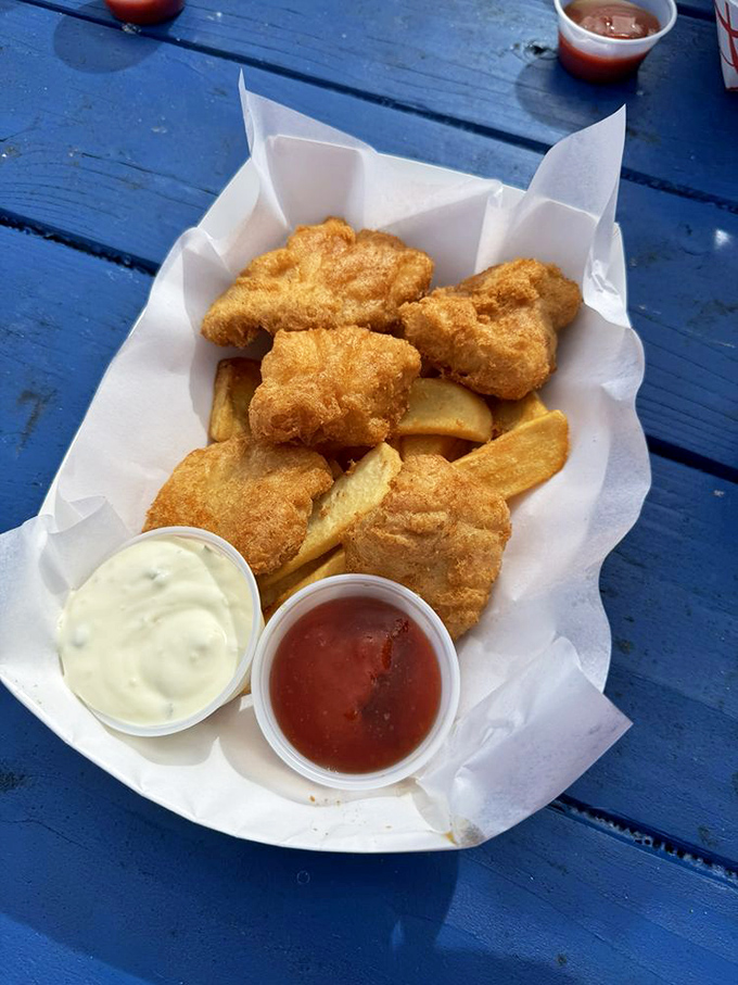 Five pieces of perfectly fried albacore arranged like a delicious puzzle atop golden fries&mdash;a simple feast fit for Neptune himself.