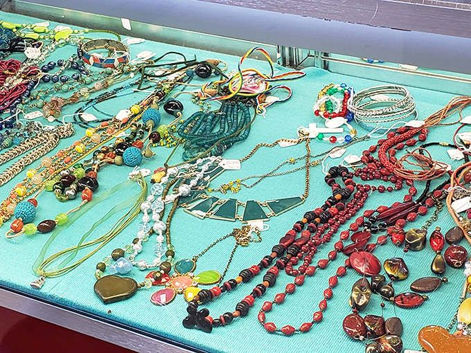 Jewelry displayed like a pirate's treasure map of possibilities. These necklaces and bracelets have lived previous lives and are ready for their next adventure around someone's neck.