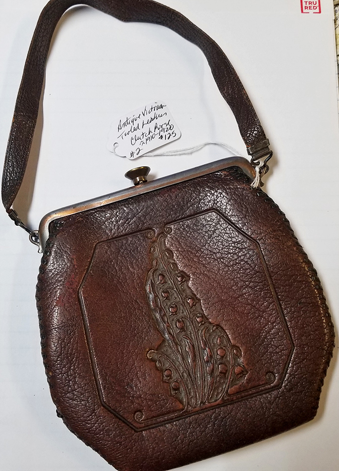 This hand-tooled leather purse once dangled from someone's wrist at a county fair or Saturday night dance&mdash;craftsmanship that's outlasted fast fashion by decades.
