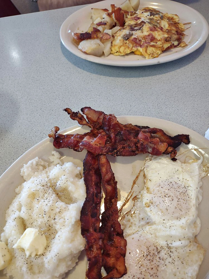 Bacon arranged like modern art, eggs cooked to cloud-like perfection. This breakfast plate is the morning equivalent of finding a parking spot right in front of the restaurant.