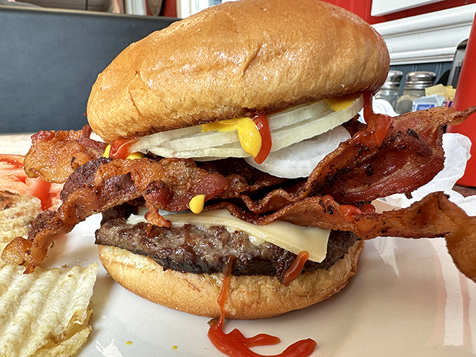 This isn't just a burger&mdash;it's an architectural achievement. The bacon practically requires structural engineering certification to support all that deliciousness.