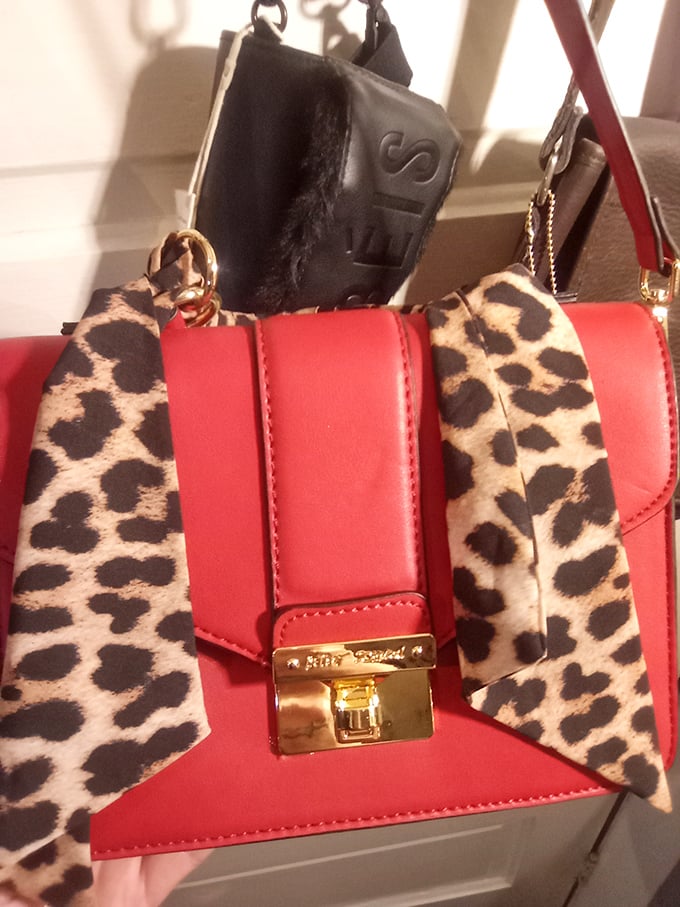 This sassy red handbag with leopard accents isn't just an accessory&mdash;it's a statement piece. Fashion karma at its finest: designer looks without the designer price tag.