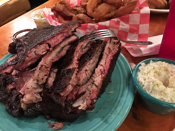 Smoke ring perfection meets fork-tender brisket. The toast is there to soak up what falls, because wasting this would be criminal.