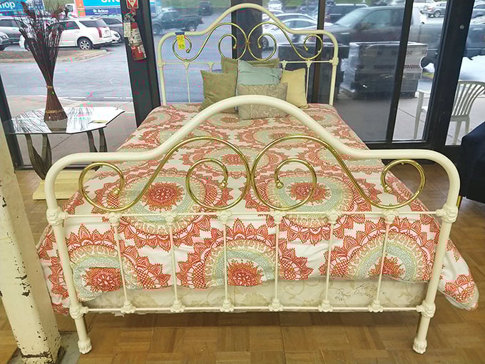 A vintage iron bed frame that whispers tales of farmhouses past, yet looks perfectly at home in today's cottagecore aesthetic.