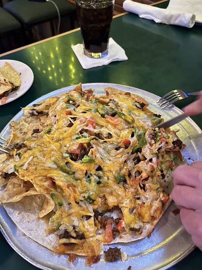 These loaded nachos aren't messing around&mdash;a mountain of chips, cheese, and toppings that requires both a fork and a game plan.