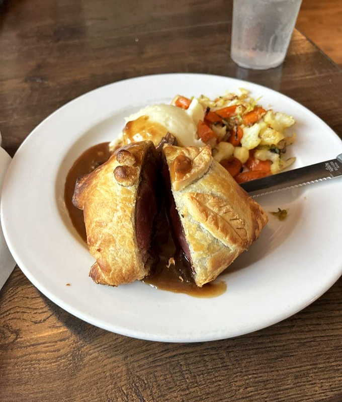 Beef Wellington: the crown jewel of British cuisine. Wrapped in pastry and mystery, it's a royal feast for commoners.
