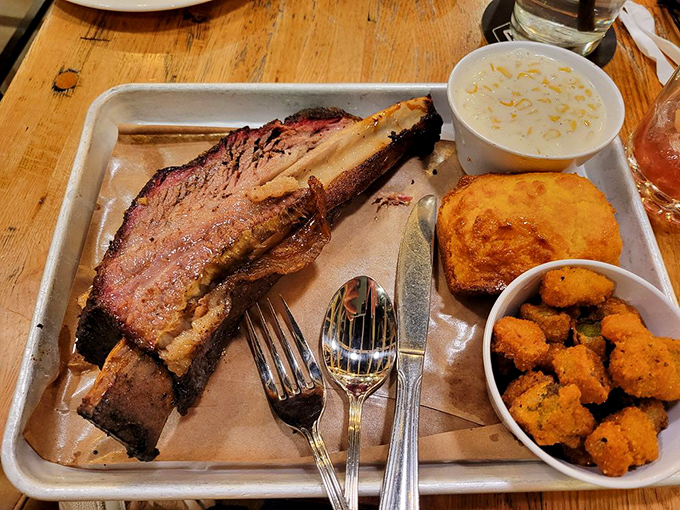 That beef rib isn't just dinner&mdash;it's prehistoric satisfaction on a tray, making you feel like Fred Flintstone at a five-star cave restaurant.