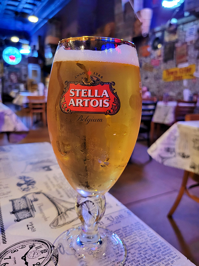 A cold Stella Artois stands ready for duty. Every great steak deserves a proper liquid companion to help it on its journey.