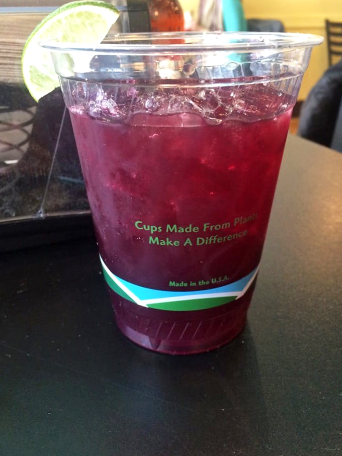 That vibrant sangria isn't just a drink, it's liquid vacation with a lime wedge passport&mdash;and the plant-based cup is just good karma.