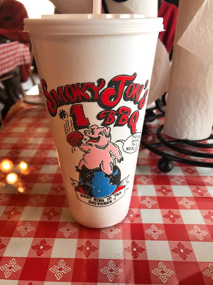 Even the cups come with attitude at Smoky Jon's, where their mascot reminds you they're "Breaking BBQ Barriers in the Universe."