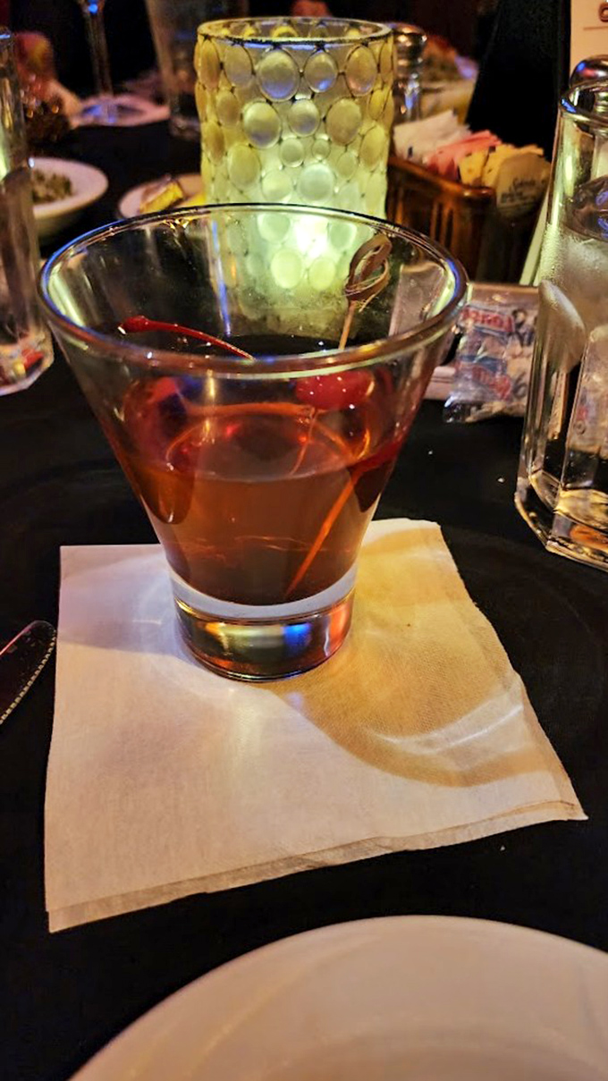 An Old Fashioned in its natural habitat&mdash;amber liquid catching the light like a jewel, ready to complement your carnivorous adventure.