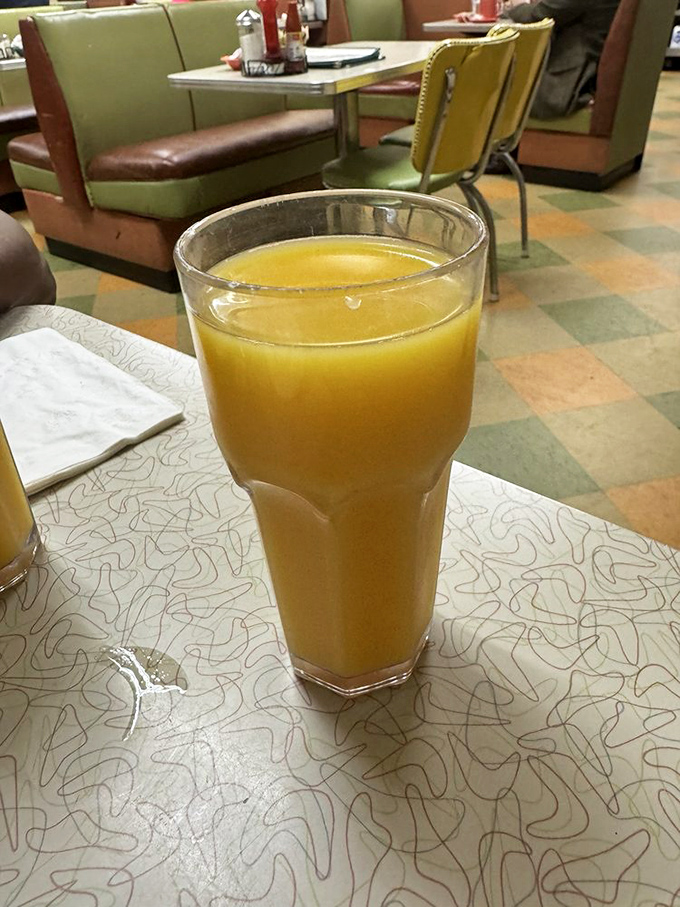 Morning sunshine in a glass—fresh orange juice served in the kind of tumbler your grandparents probably still have in their kitchen cabinet.