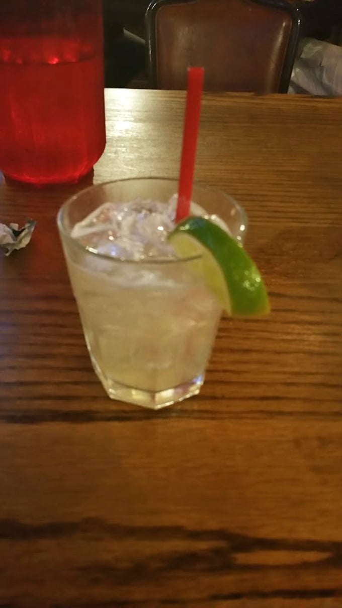 A proper cocktail with a lime wedge perched on the rim &ndash; because even in cowboy country, a little citrus civility goes a long way. 