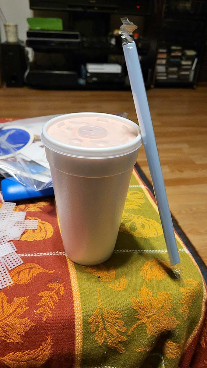 Even the drinks come with a side of no-nonsense charm. That straw is your direct pipeline to refreshment between bites of flaky, fried goodness.