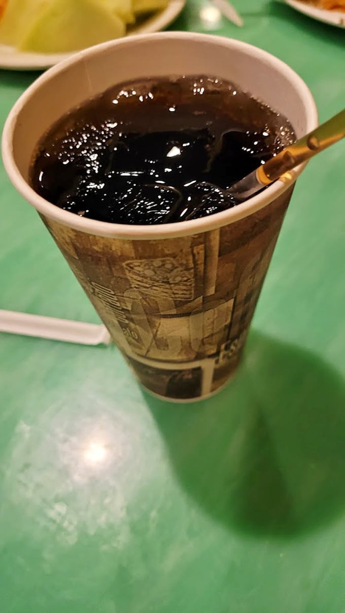 Even your beverage gets the royal treatment. A simple soda becomes part of the experience when dining is theater.