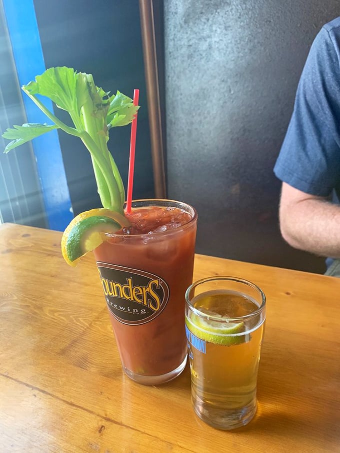 A Bloody Mary garden growing from a glass, complete with cucumber, celery, and lime. Vegetables count as breakfast, right?
