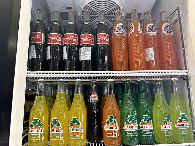 The Mexican soda selection rivals the Pantone color chart. Each bottle promises a sweet escape from ordinary beverages.