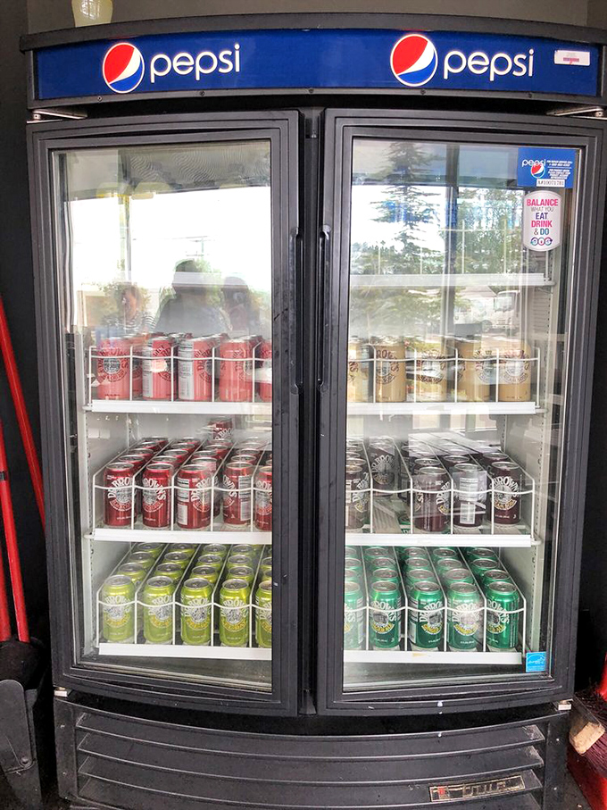 The beverage cooler stands ready like a hydration station for sandwich expeditions. Because conquering mountains of meat requires proper preparation.