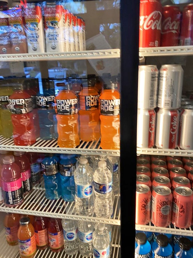 The beverage cooler&mdash;where decisions between classic Coca-Cola and those colorful Power Ades become existential dilemmas before a sandwich feast.