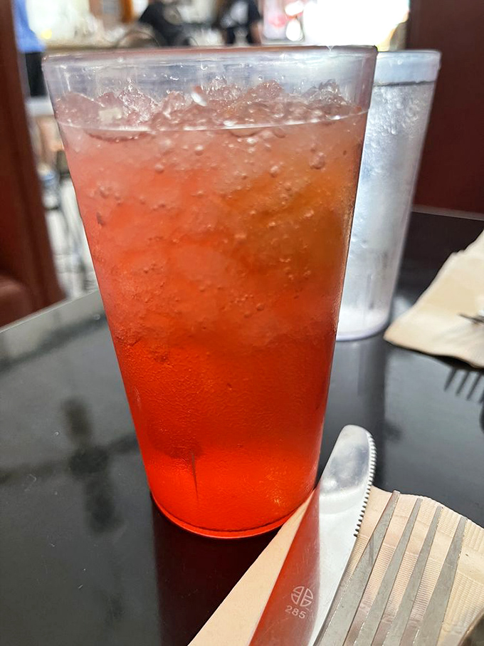 That vibrant red drink isn't just refreshing&mdash;it's like summer decided to throw a party in a glass, complete with ice cubes that tinkle like wind chimes.