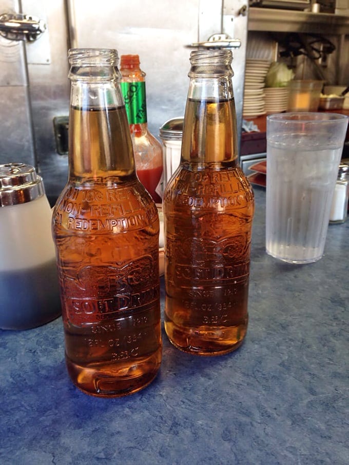 These vintage bottles aren't just beverages; they're liquid nostalgia served cold, complete with "No Refill" embossed warnings from simpler times.