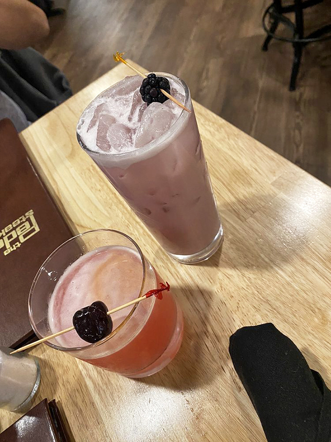Cocktails garnished with berries&mdash;because sometimes your bourbon needs a little fruity hat before joining the party in your stomach.